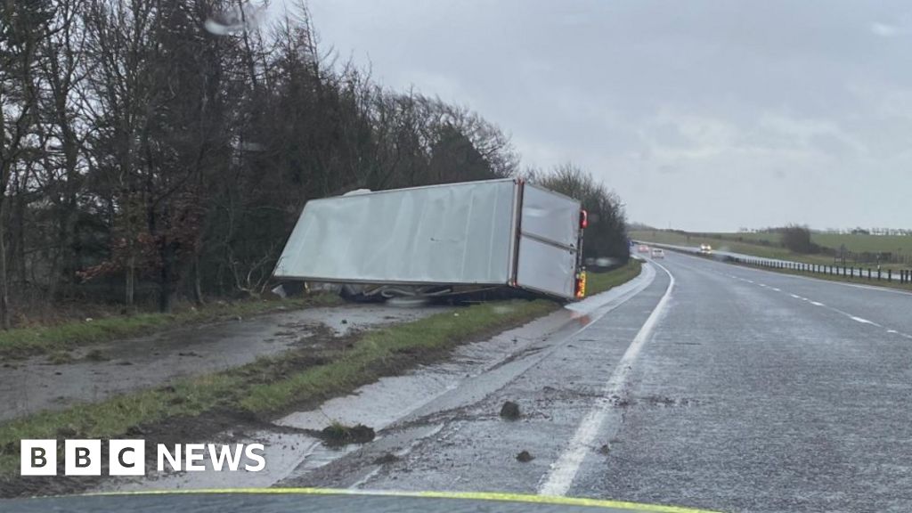 Overturned lorry closes Gloucestershire road in high winds - BBC News