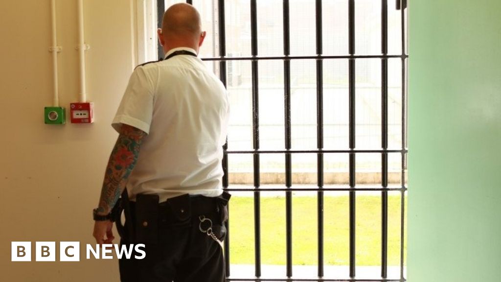 Assaults on prison staff at record high, figures show - BBC News