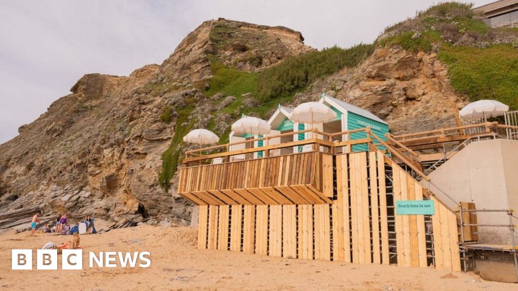 Luxury beach huts on Watergate Bay repaired after storm damage - BBC News