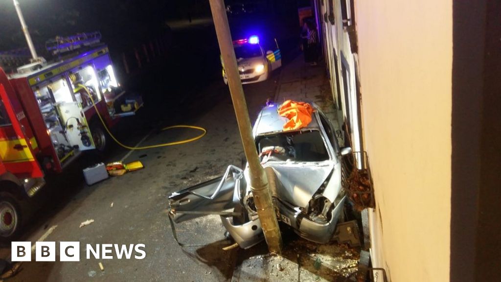 Car crashes into lamp-post outside couple's Treharris home