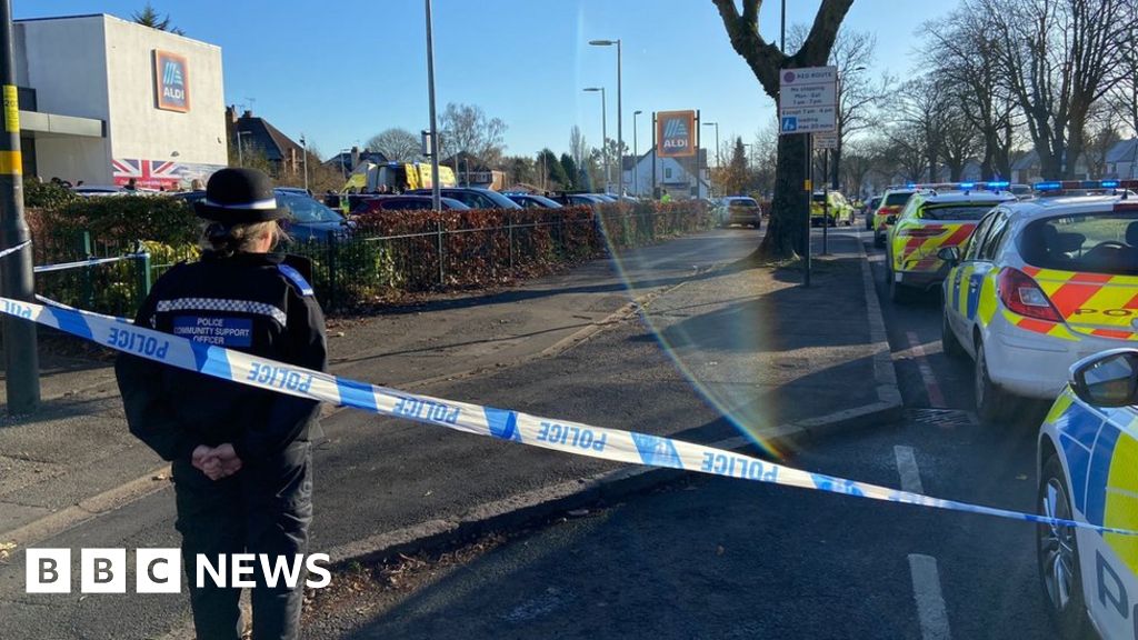 Woman dies after being hit by vehicle on Aldi car park - BBC News