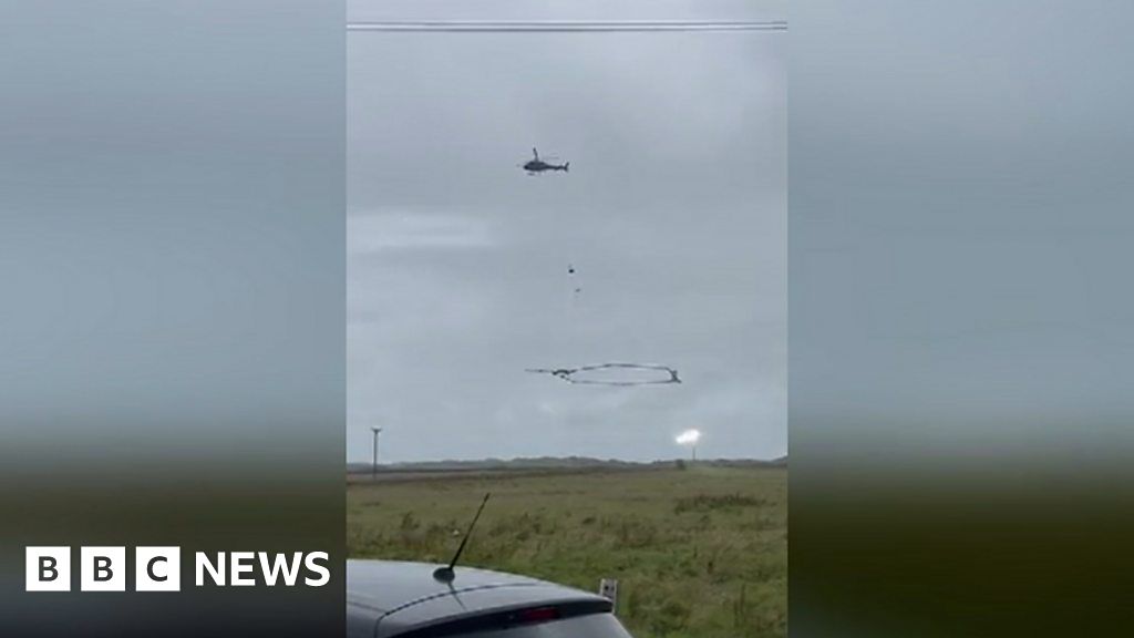 Electricity pylon struck by antenna suspended from helicopter - BBC News