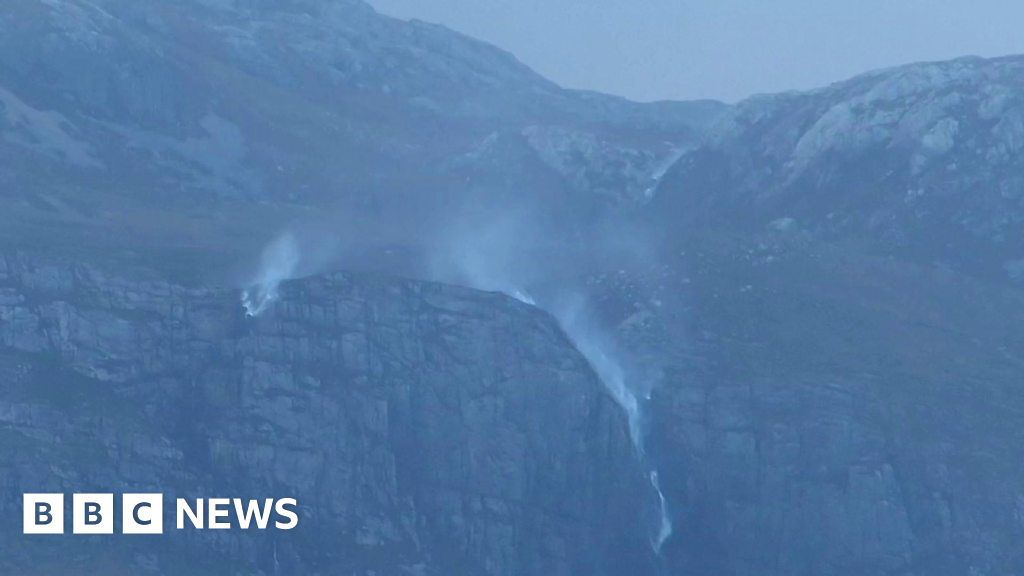 Waterfall blown backwards and snow sideways in Torridon - BBC News