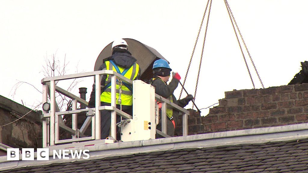 Demolition work begins on fire-damaged buildings - BBC News