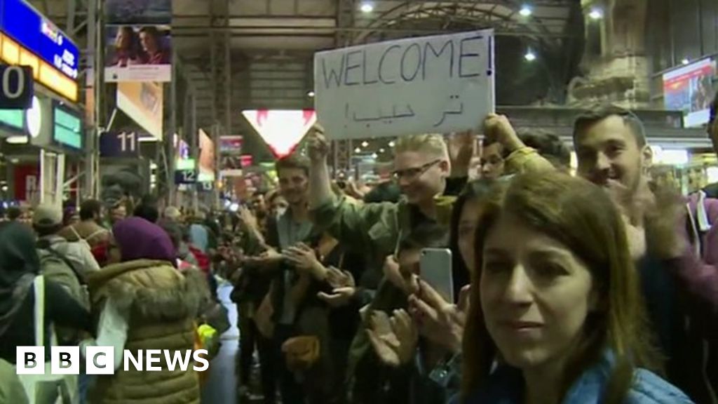 Germans give warm welcome to migrants - BBC News