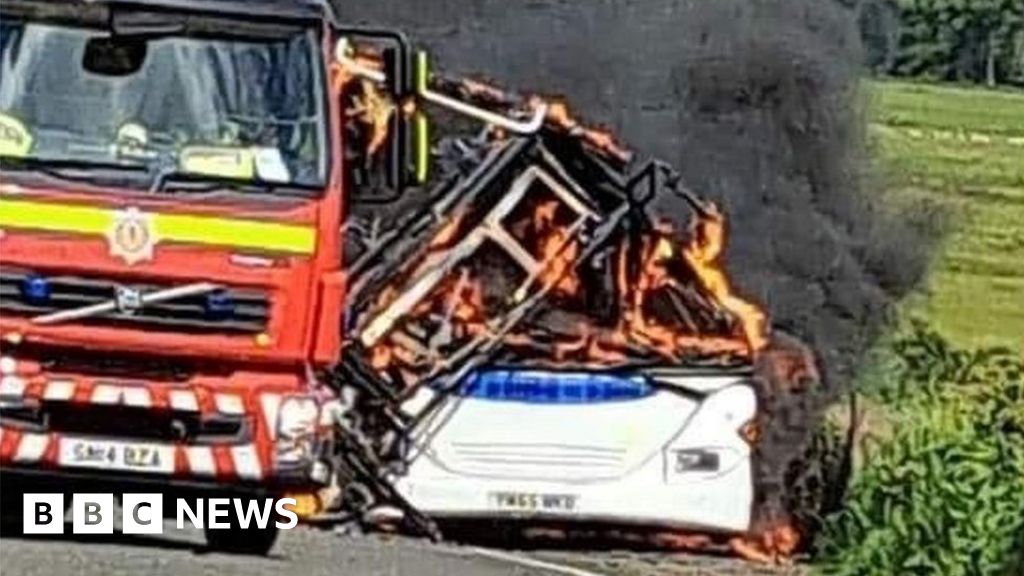 School bus catches fire after pupils evacuated - BBC News