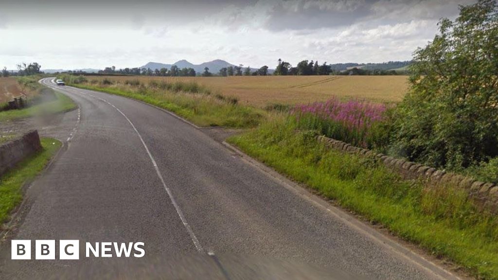 Woman cut from car hanging over bridge - BBC News