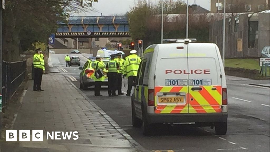 Man knocked down by marked police car in Fife - BBC News