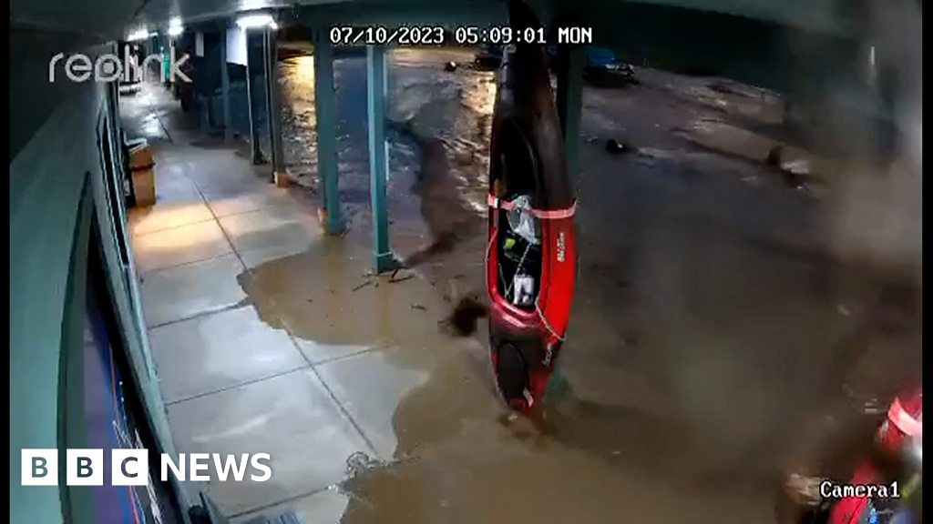 Watch a parking lot fill with water in seconds in flash flood