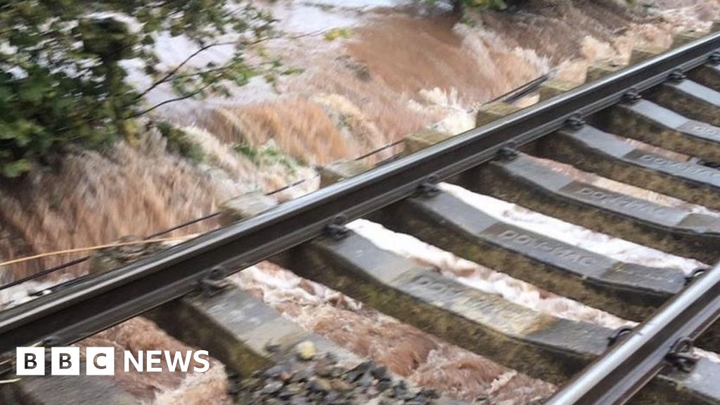 Flood-damaged train line to stay closed for a week - BBC News