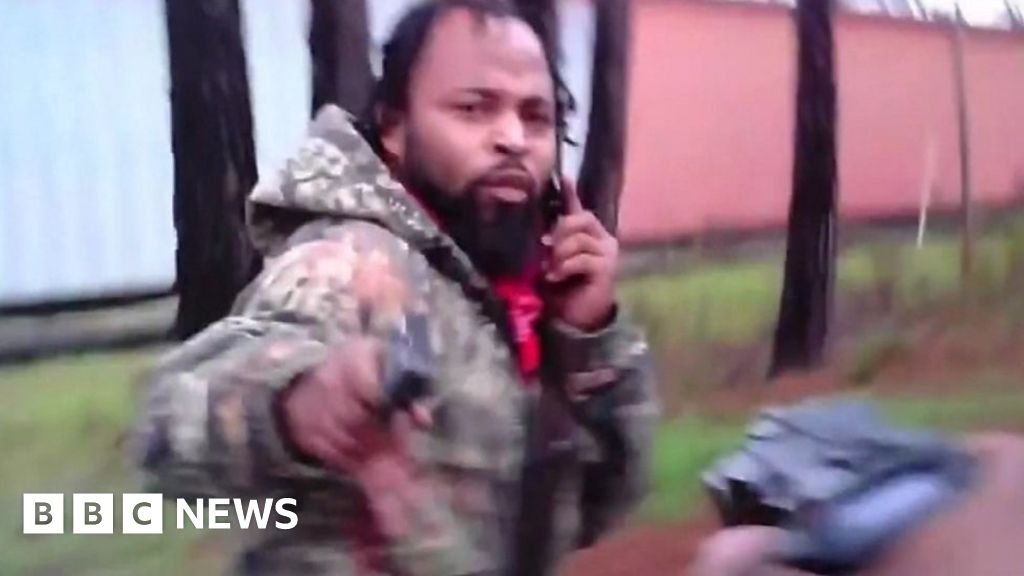 US police officer records moment he is shot at close range