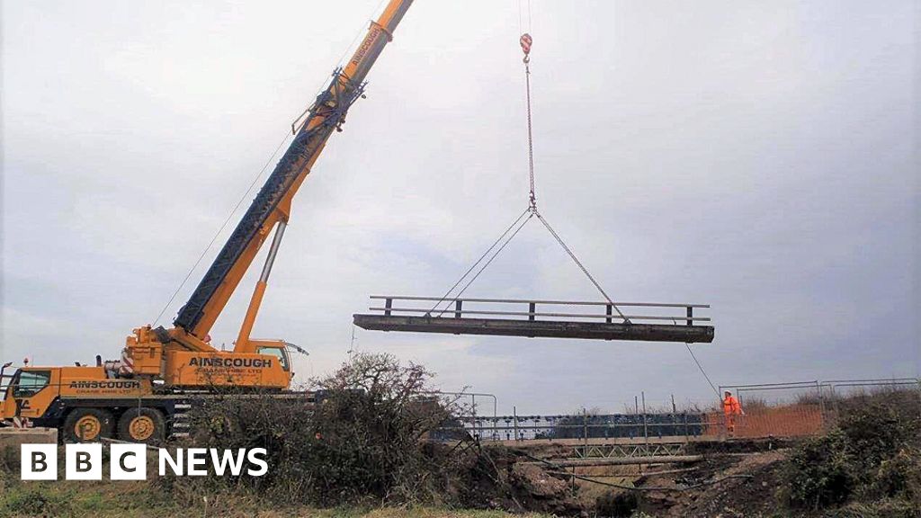 Robert Burns' Brow Well bathing spot bridge put in place - BBC News