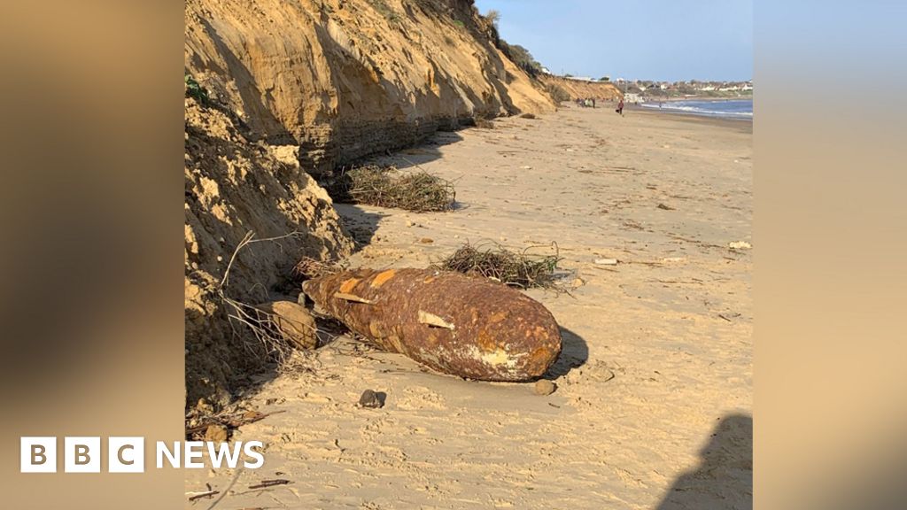 Pakefield caravans evacuated as cliff fall reveals suspected bomb - BBC ...