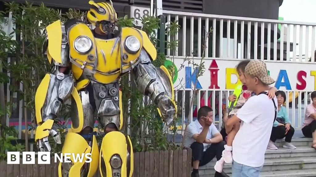 Father dresses as Transformer on son's first day back at school