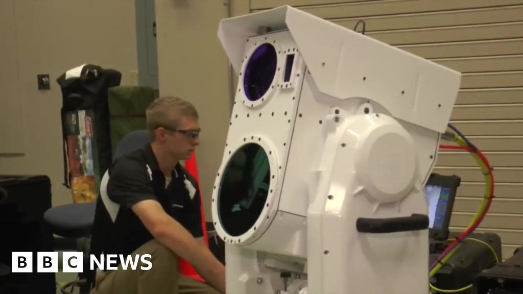 Boeing laser shoots drone from sky - BBC News