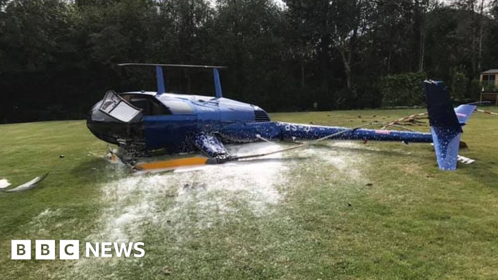 Pilot injured as helicopter overturns in Barwell on take-off - BBC News