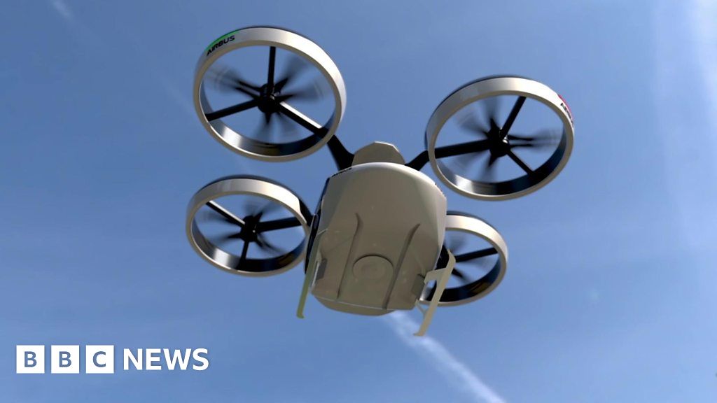 Passenger-carrying drone converts to car - BBC News