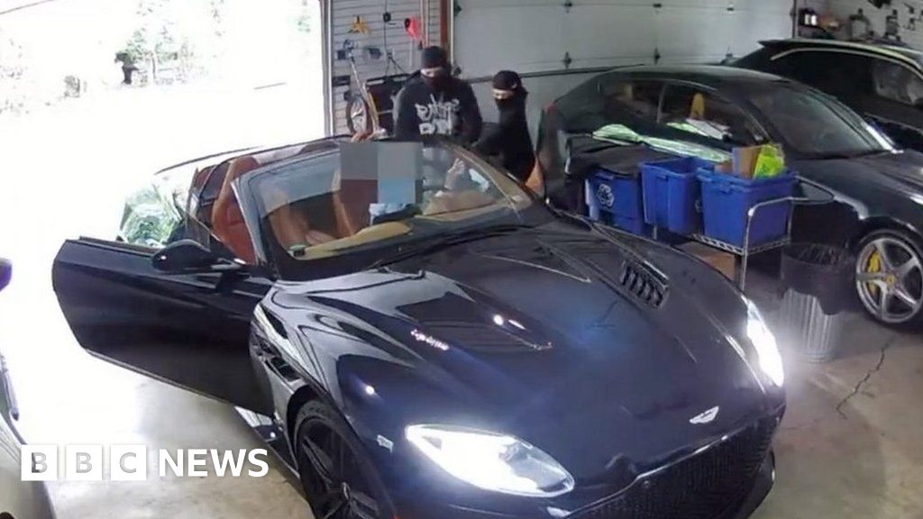 Video shows Aston Martin get carjacked in owner's home - BBC News