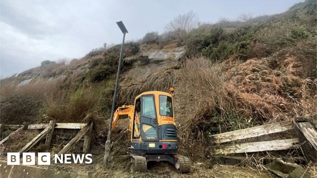 Isle of Wight coastal path reopens after cliff fall - BBC News