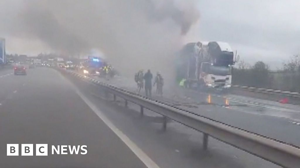 Motorway re-opens after transporter lorry fire - BBC News