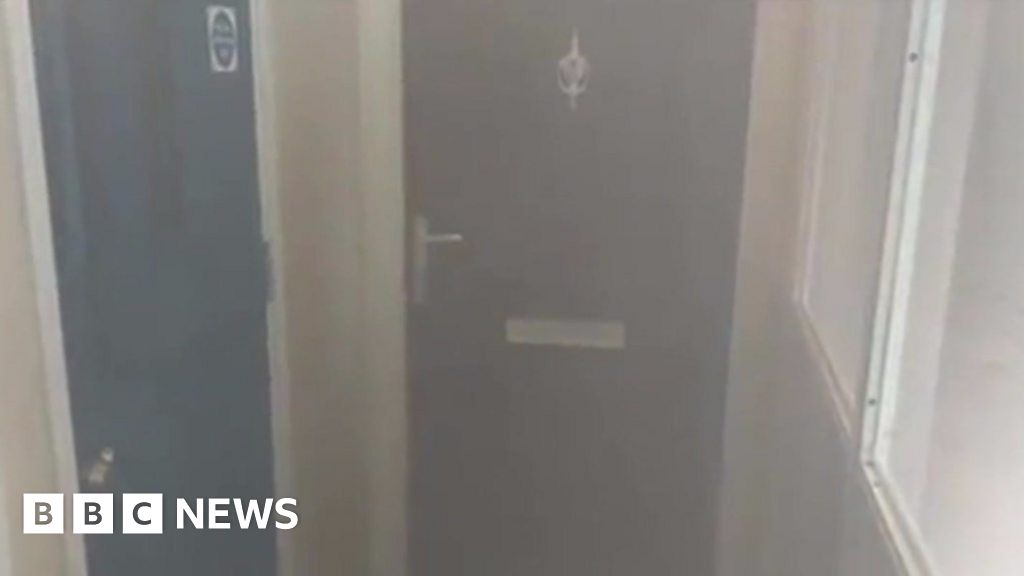 Tower block resident tests fire doors with smoke experiment - BBC News
