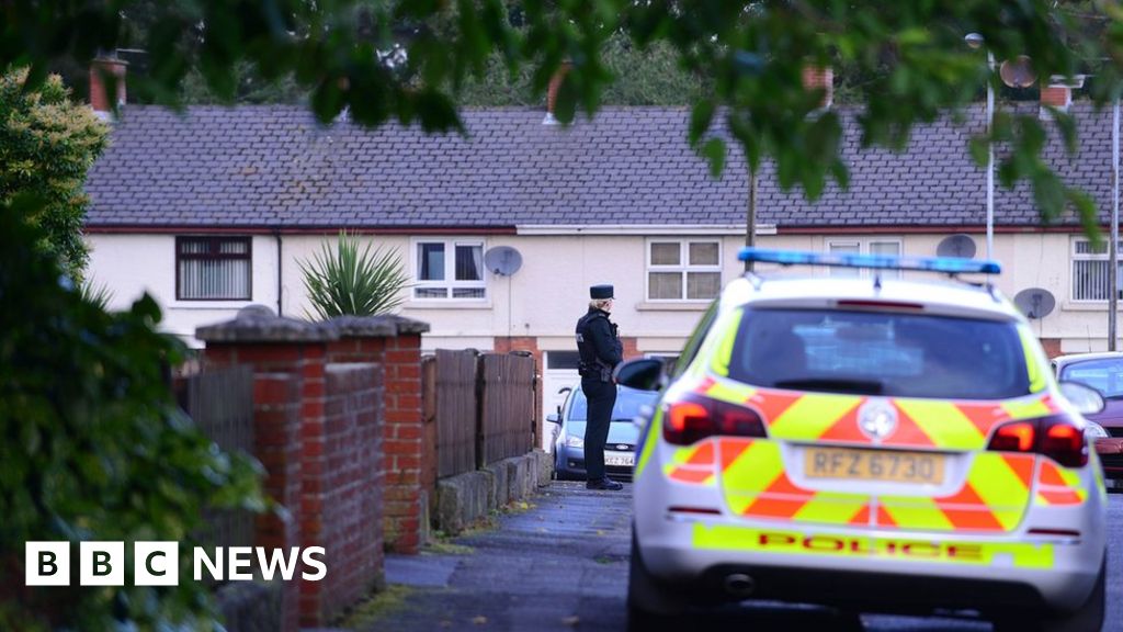 Arrest after man's body found in car in Lisburn - BBC News