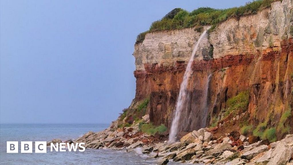 Hunstanton clifftop waterfall photographed after storm - BBC News