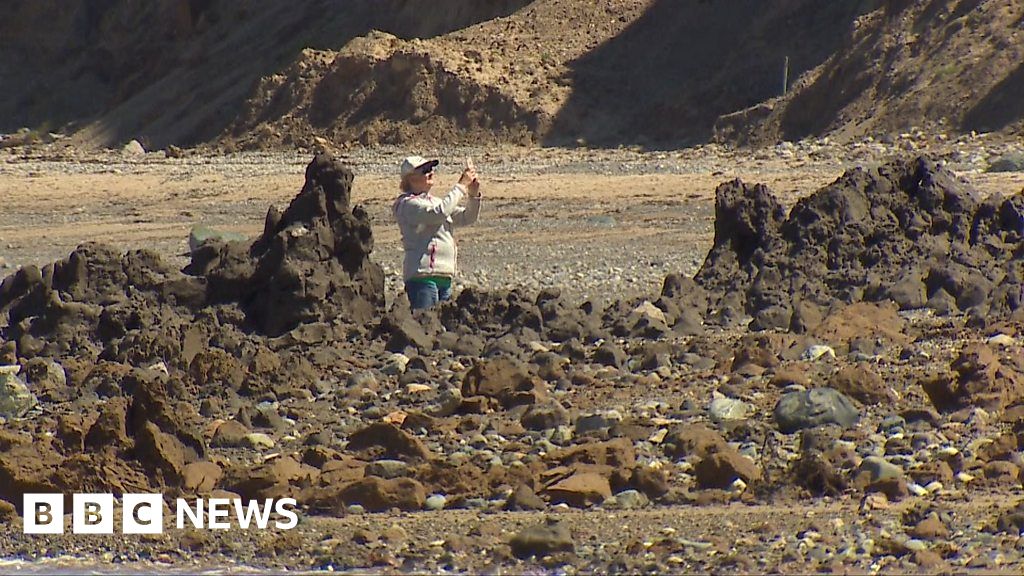 Nefyn landslide sunbathers 'need their heads examined' - BBC News