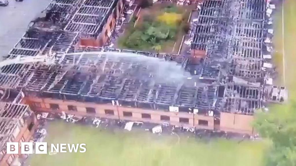 Drone footage shows Holiday Inn destroyed by fire - BBC News