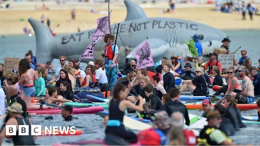 G7 in Cornwall: Environmental protesters take to streets and sea