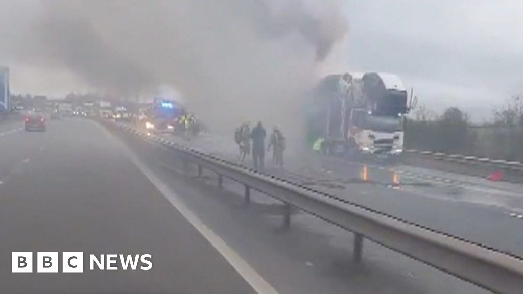 Truck loaded with cars catches fire on M74