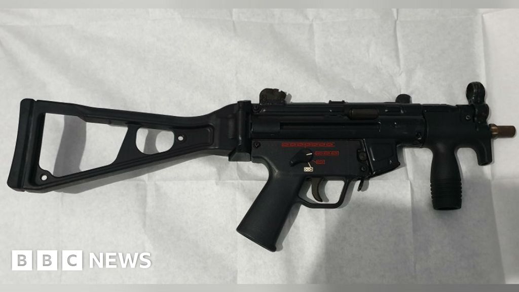 Two arrested after submachine gun found in loft in Everton - BBC News