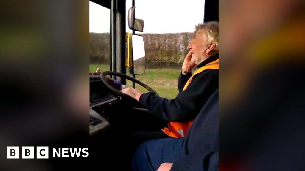 Leicestershire bin lorry driver filmed on mobile phone - BBC News