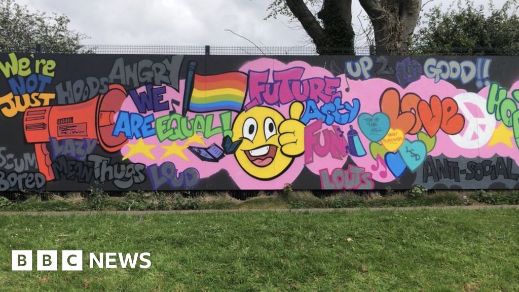 Artists create symbols of hope on Derry's walls - BBC News