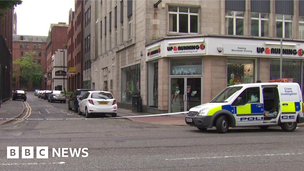 Two stabbed as groups clash in Manchester city centre - BBC News