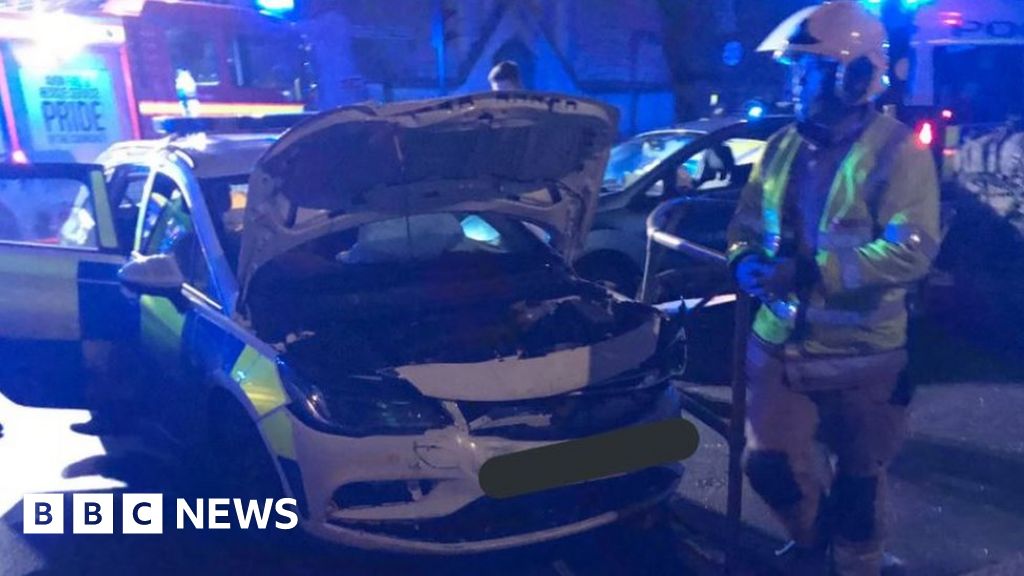Officer treated for suspected neck injury after police car crash - BBC News