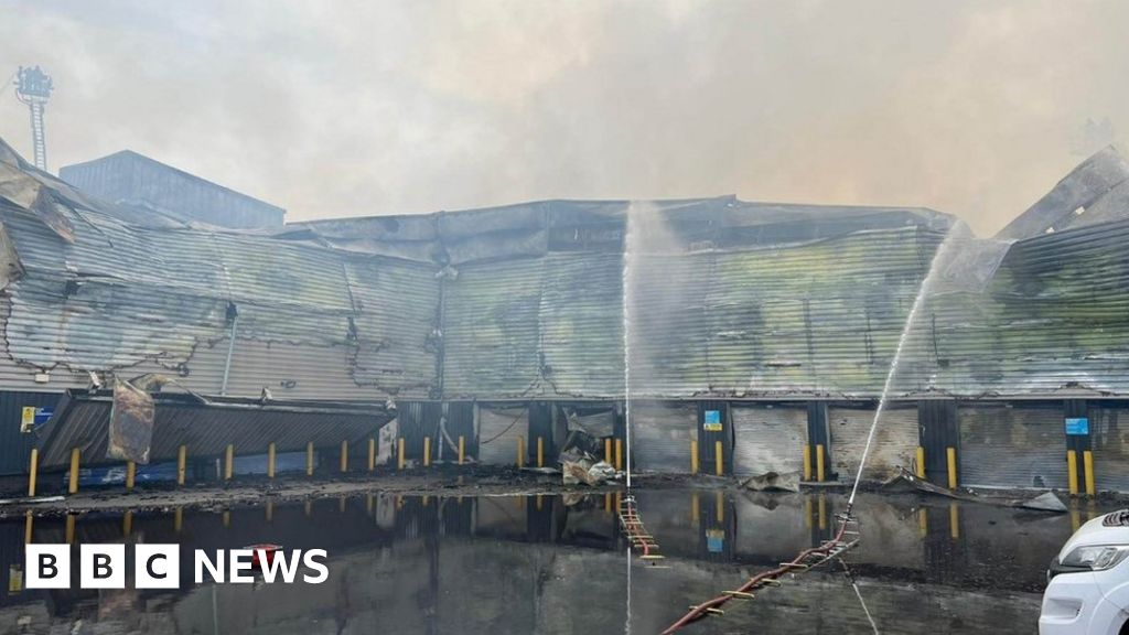 Byfleet fire: Crews at scene of storage blaze for second day