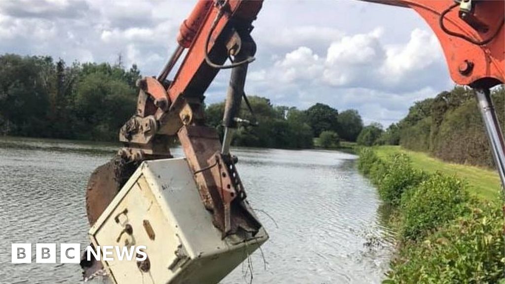 Safe pulled from fishing lake after post office robbery