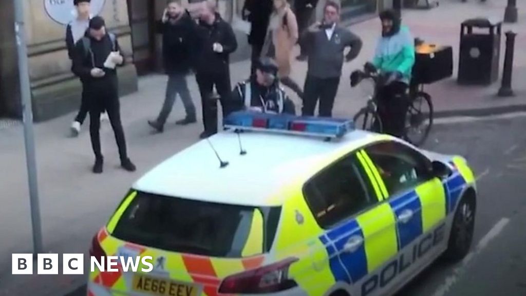 Manchester traffic warden tickets police car - BBC News
