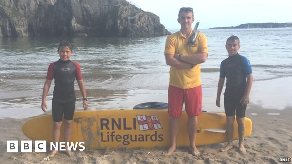 Two children rescued from rip current off Tenby Castle beach - BBC News