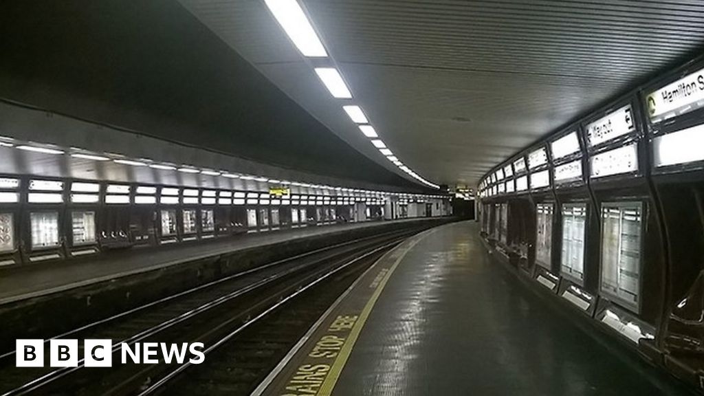 Guard denies causing woman's fall at Merseyrail station - BBC News