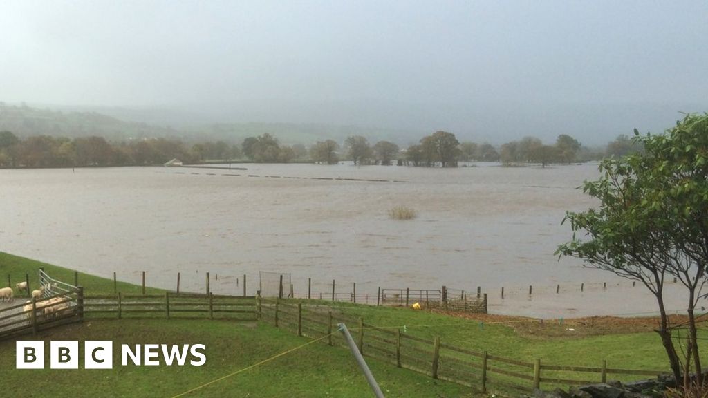 Conwy Valley rail line reopens after Snowdonia flooding - BBC News