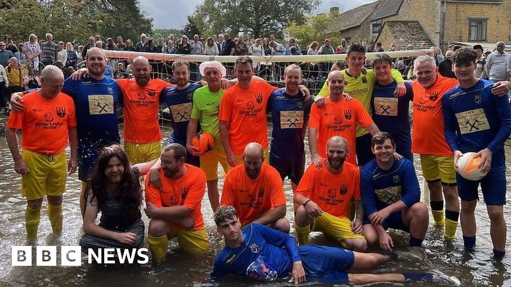 Bourton-on-the-Water football match in river draws huge crowd - BBC News