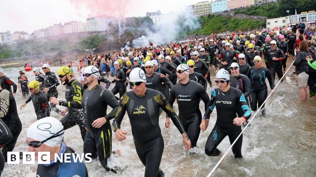 Thousands cheer on Long Course Weekend triathletes in Tenby - BBC News