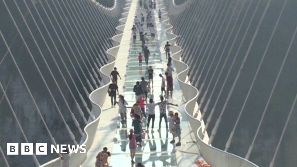 China's glass-bottomed bridge welcomes first visitors - BBC News