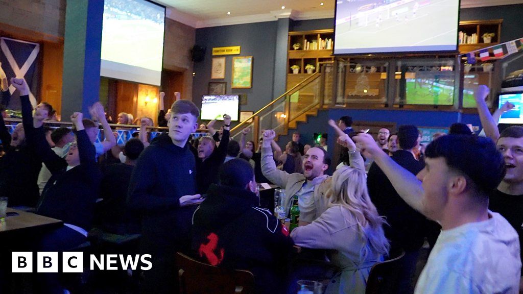Jubilant Scotland fans celebrate England own goal