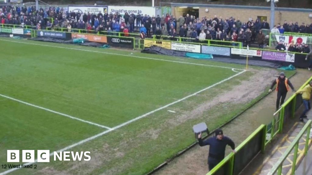 Bury fans avoid ban for Forest Green Rovers pitch invasion - BBC News