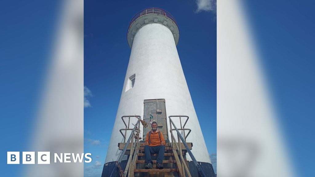 Lighthouse fan completes epic British coast walk for charity - BBC News