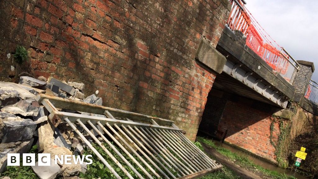 Man knocked off bridge in vehicle crash - BBC News