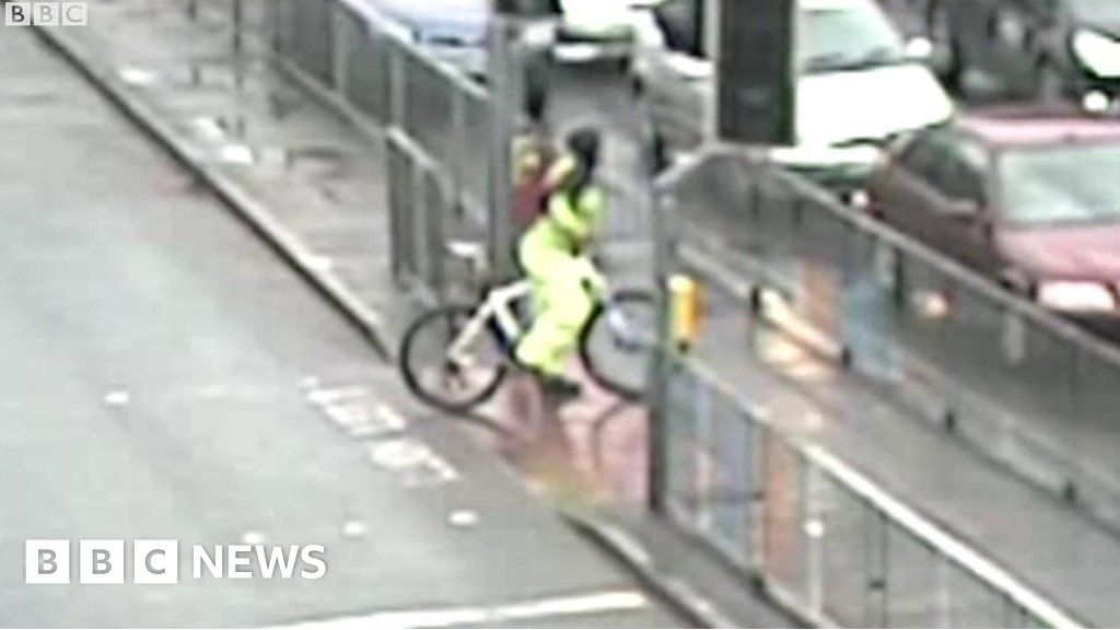 Police release CCTV footage of driver mounting kerb - BBC News